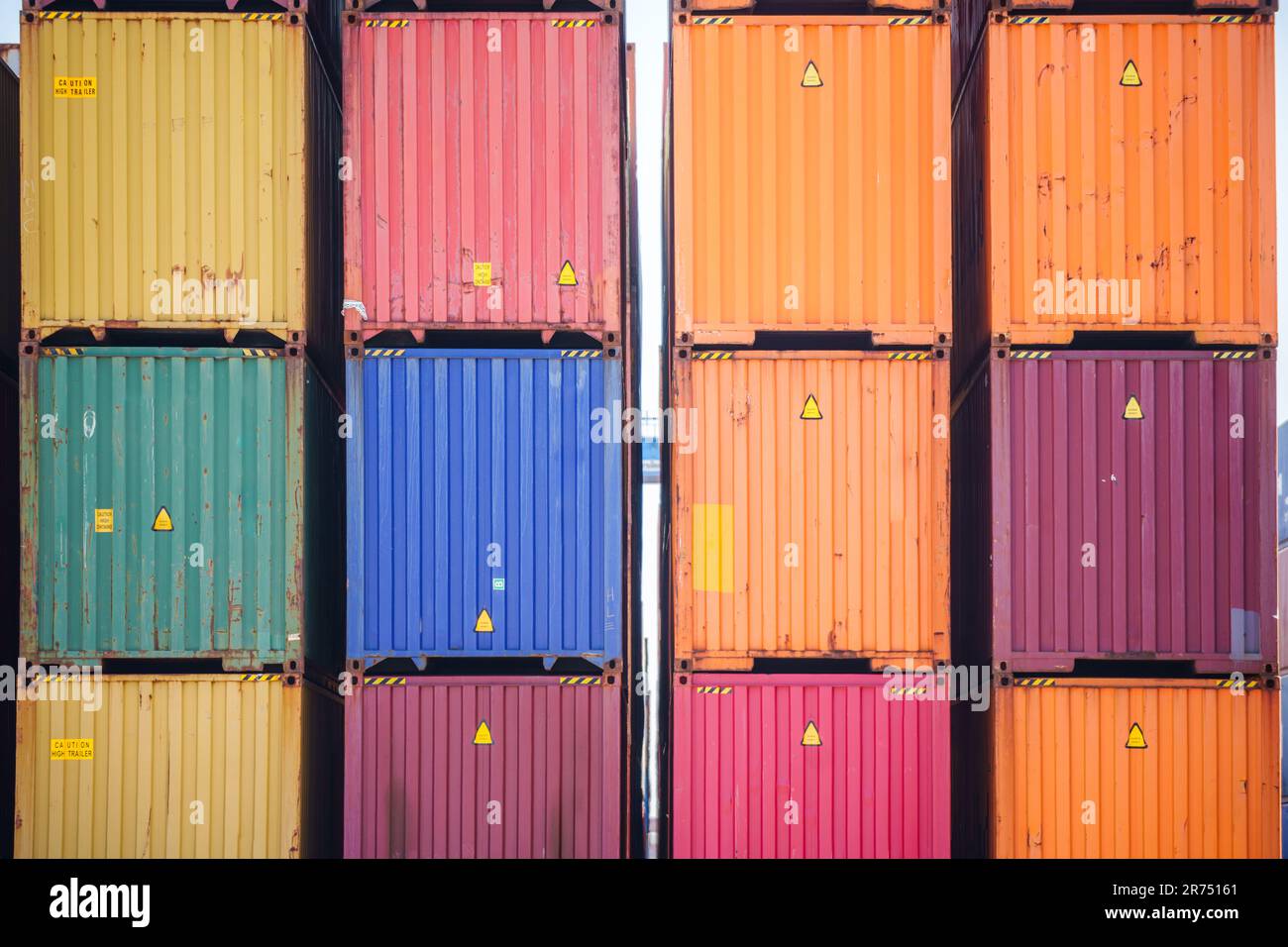 Shipping containers stacked at a commercial port Stock Photo - Alamy