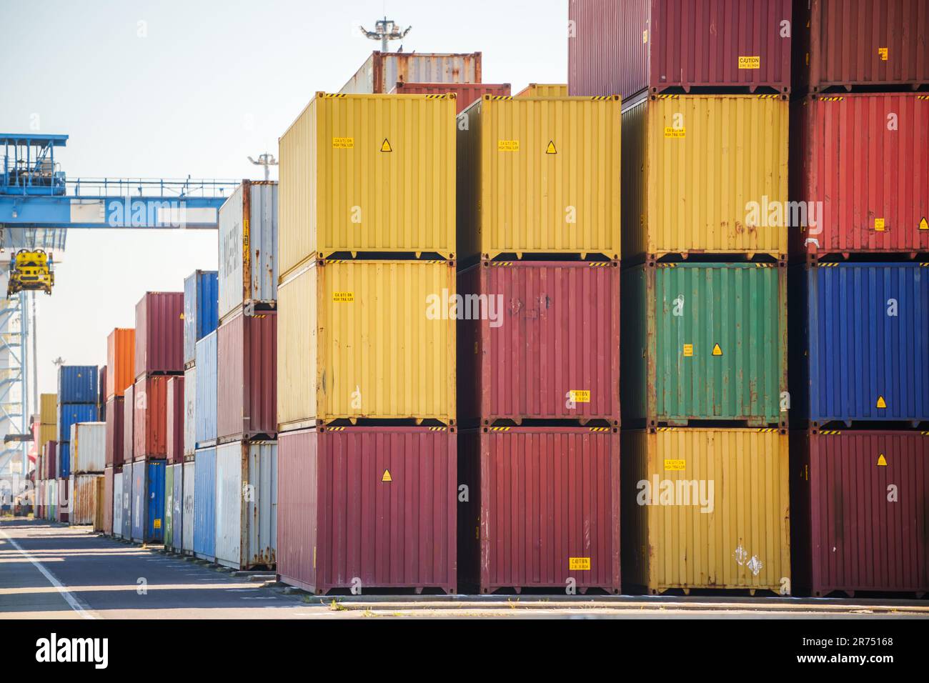 Shipping containers stacked at a commercial port Stock Photo - Alamy