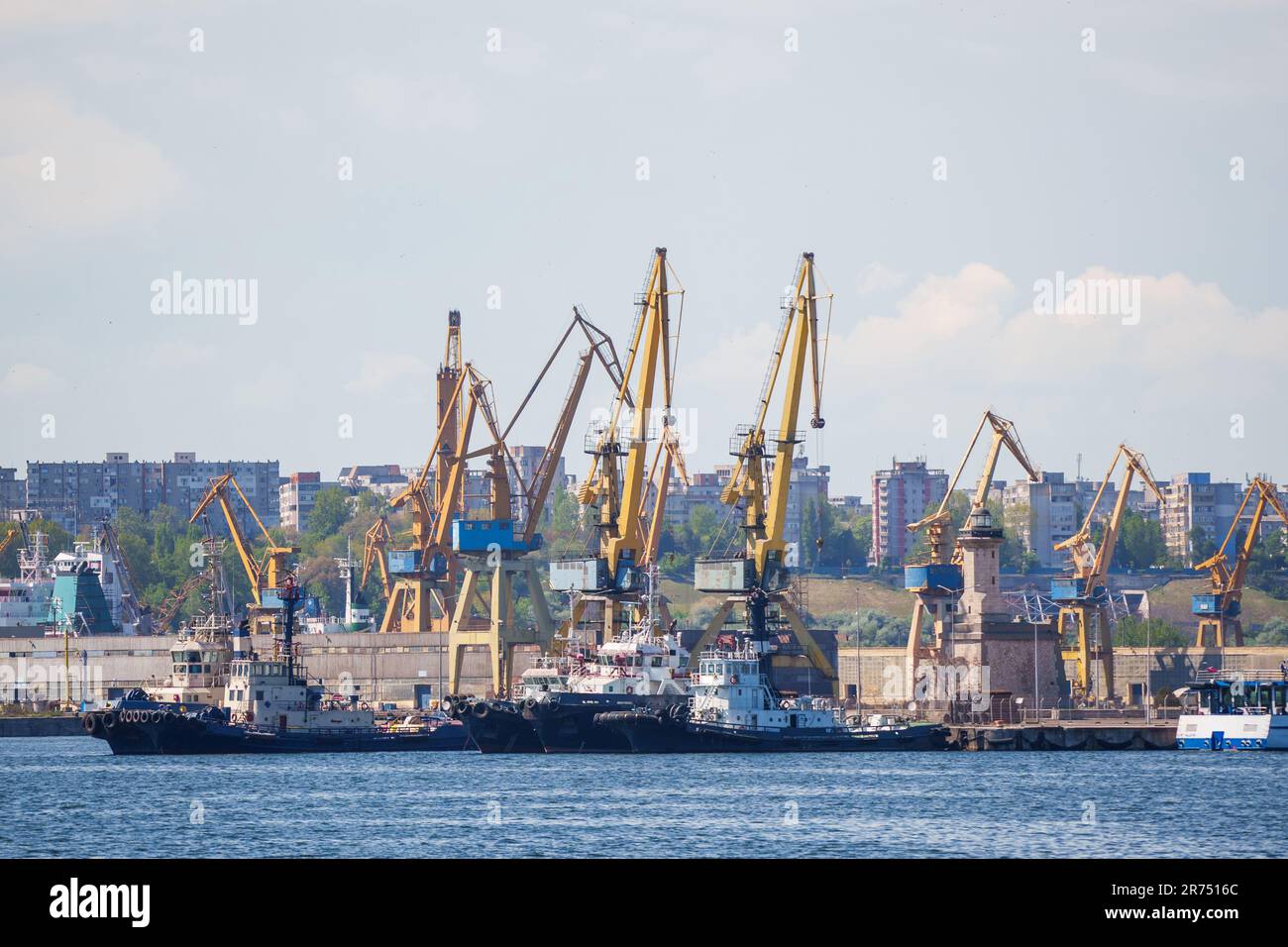 Container terminal, with cranes, in a commercial port Stock Photo - Alamy