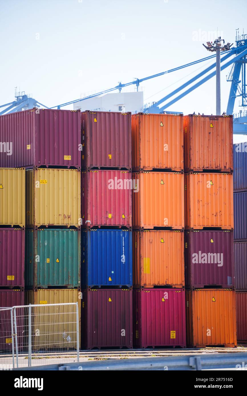 Shipping containers stacked at a commercial port Stock Photo - Alamy