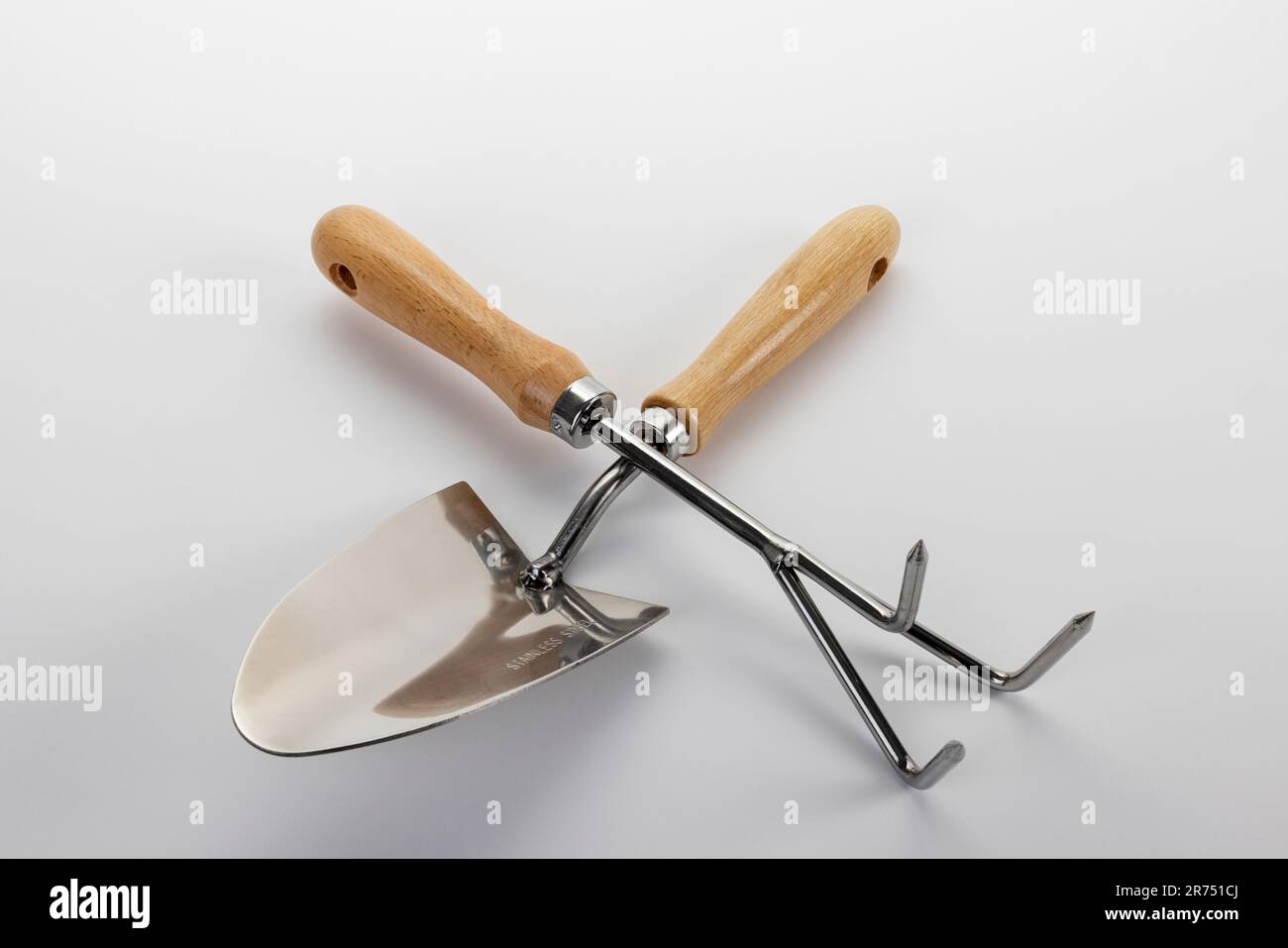 Flower trowel, hand hoe with wooden handle, white background Stock ...