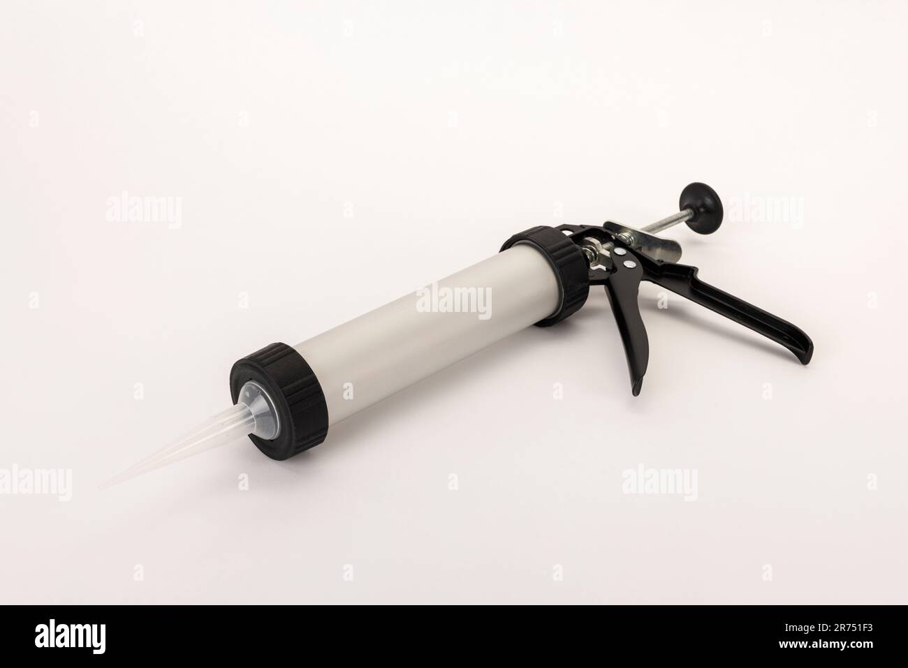 Tube cartridge press, white background Stock Photo - Alamy