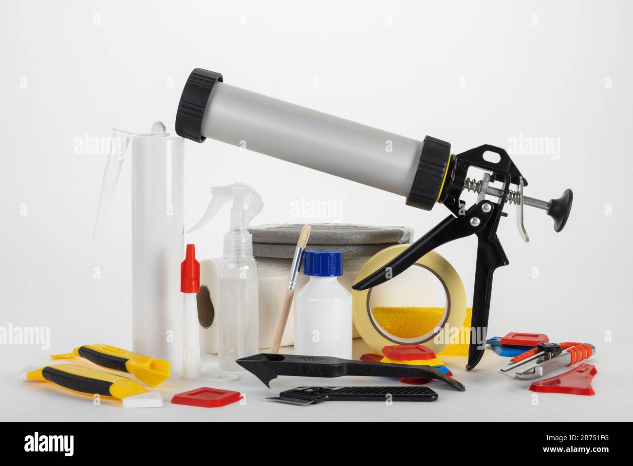 Cartridge press next to it silicone cartridge, tools and materials to ...