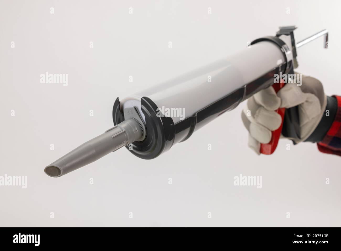 Man hand with glove holding half shell cartridge press with silicone ...