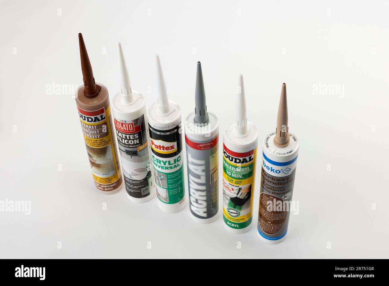 Acrylic and silicone cartridges from different manufacturers standing ...