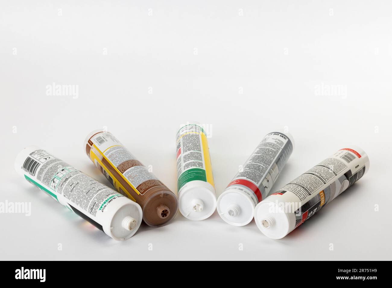 Acrylic and silicone cartridges from different manufacturers lying ...