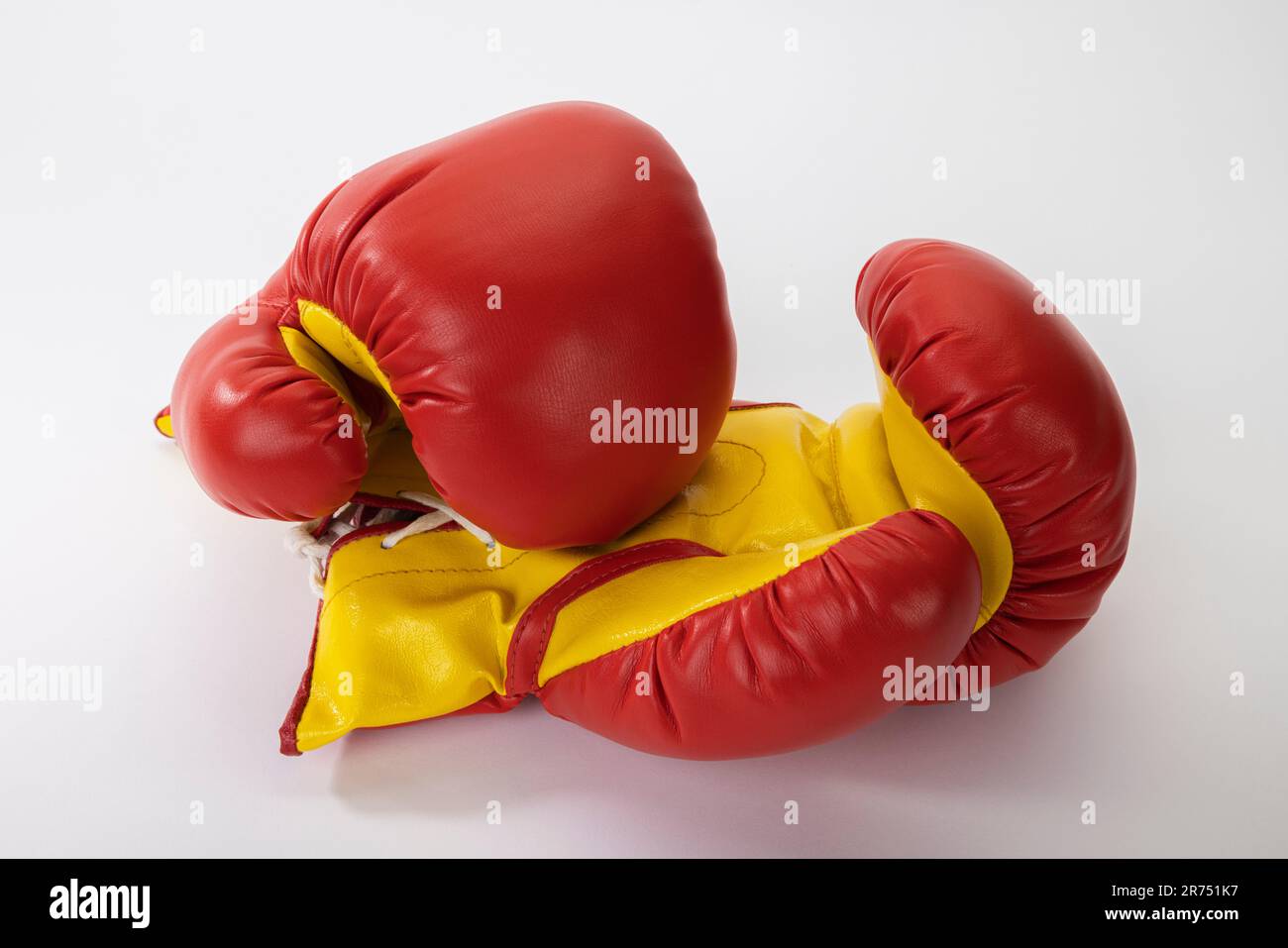Pair of red and yellow boxing gloves, white background Stock Photo - Alamy