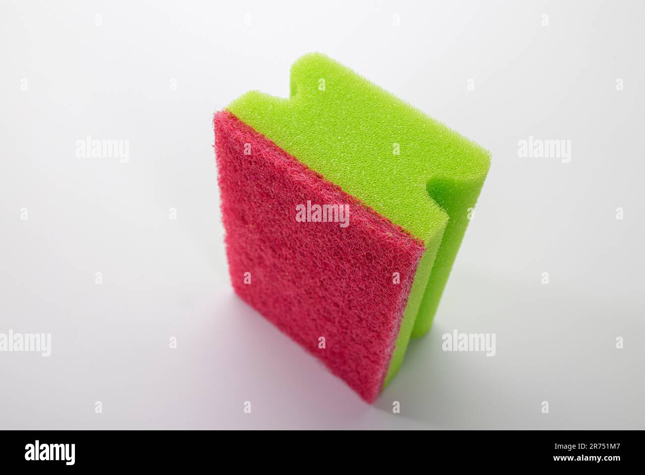 Cleaning sponge with handle green-red, white background Stock Photo - Alamy