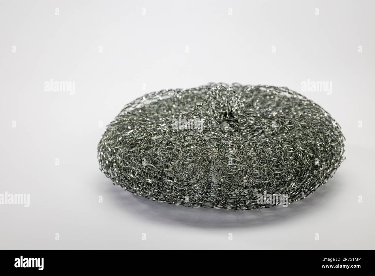 Metal pot cleaner, white background Stock Photo - Alamy