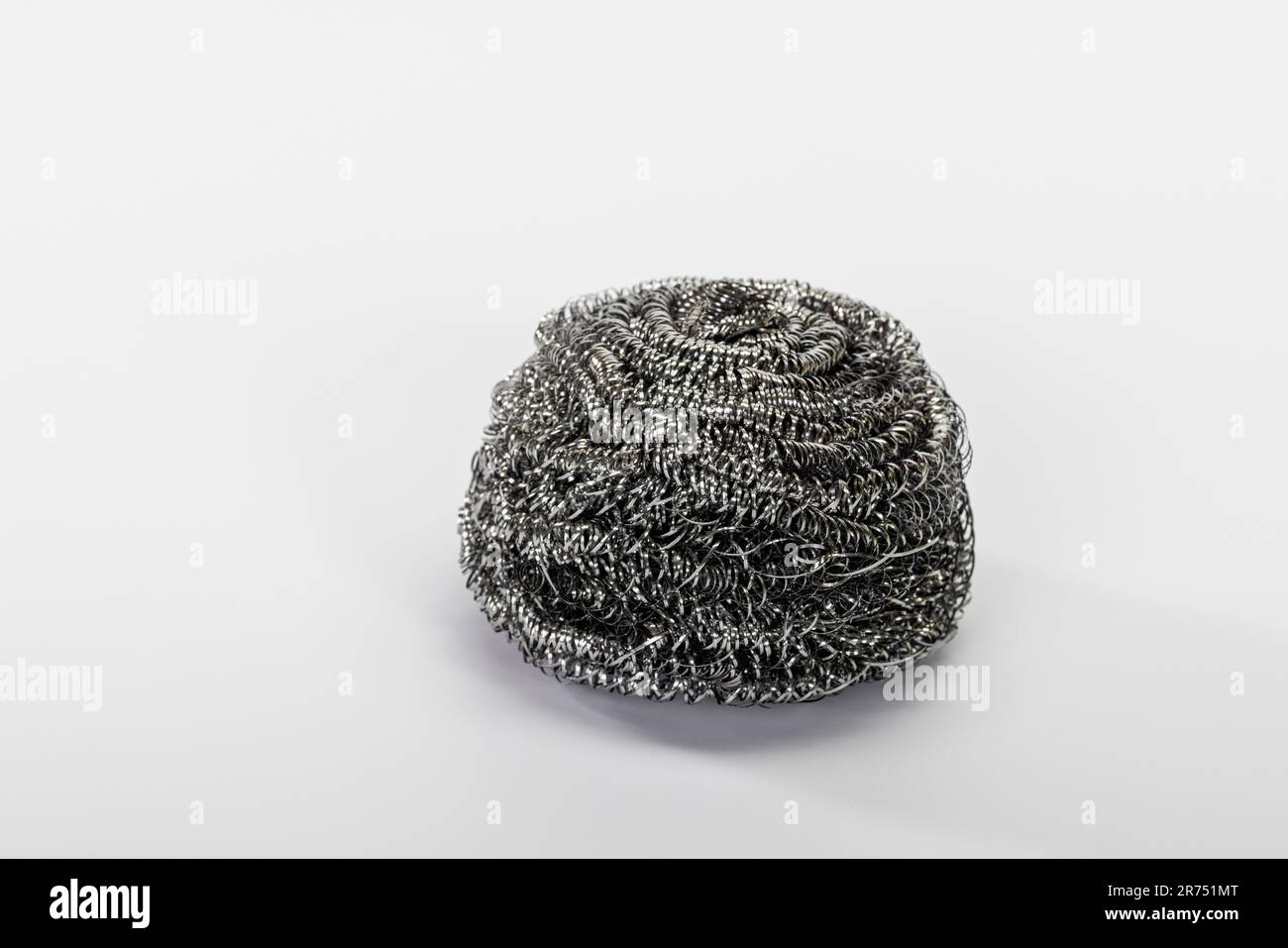 Metal pot cleaner, stainless steel, white background Stock Photo - Alamy