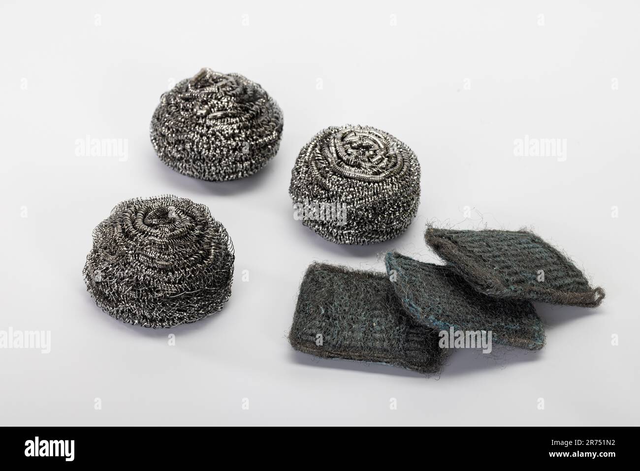 Various metal pot cleaner, white background Stock Photo - Alamy