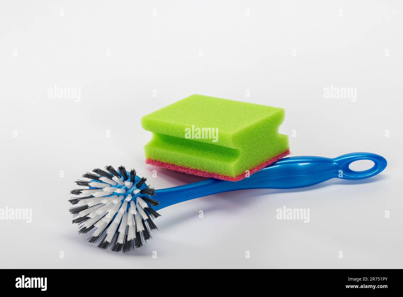 Blue dish brush, cleaning sponge, white background Stock Photo - Alamy