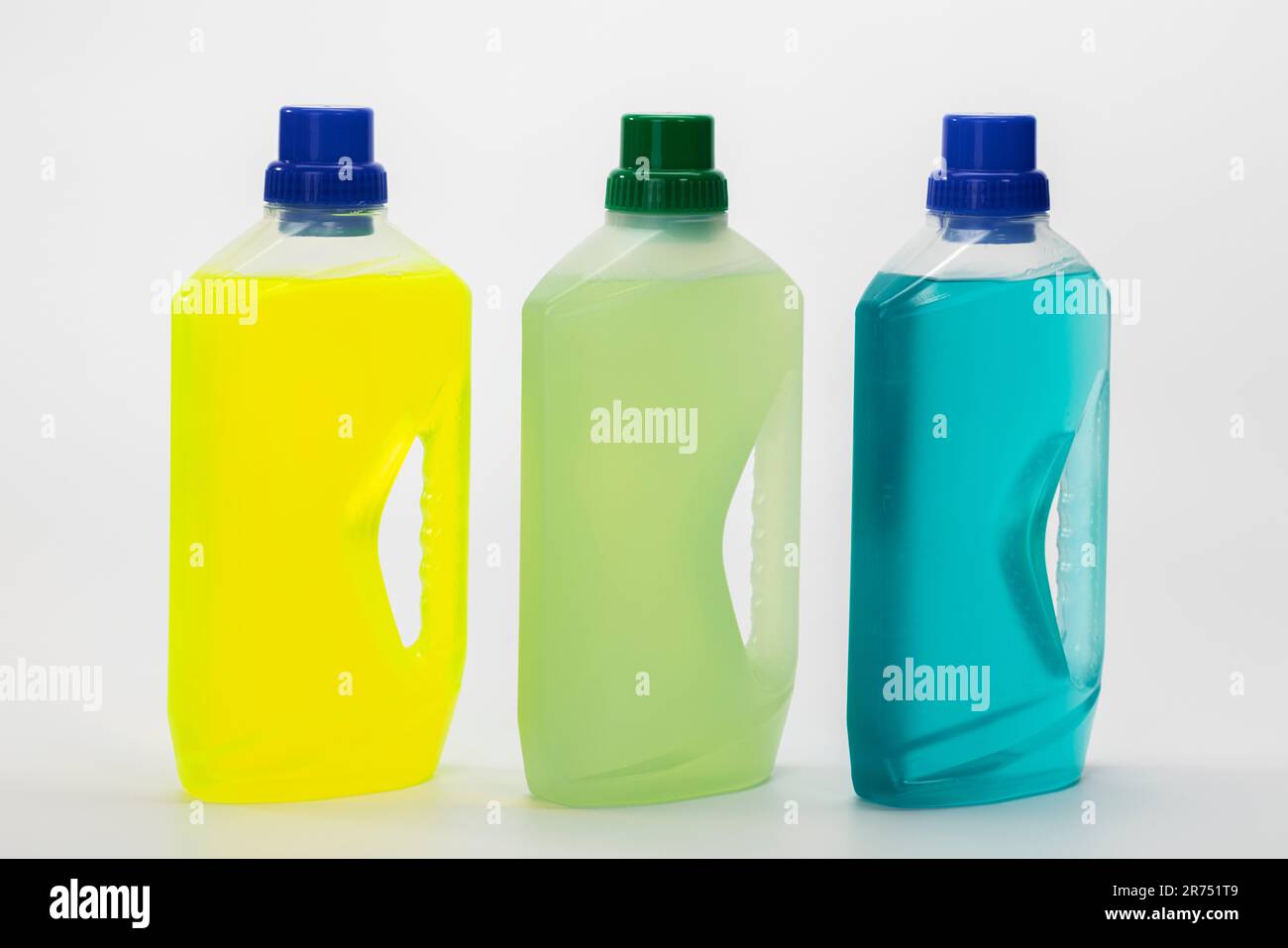 Three plastic bottles, universal cleaner, yellow, green, blue, white ...