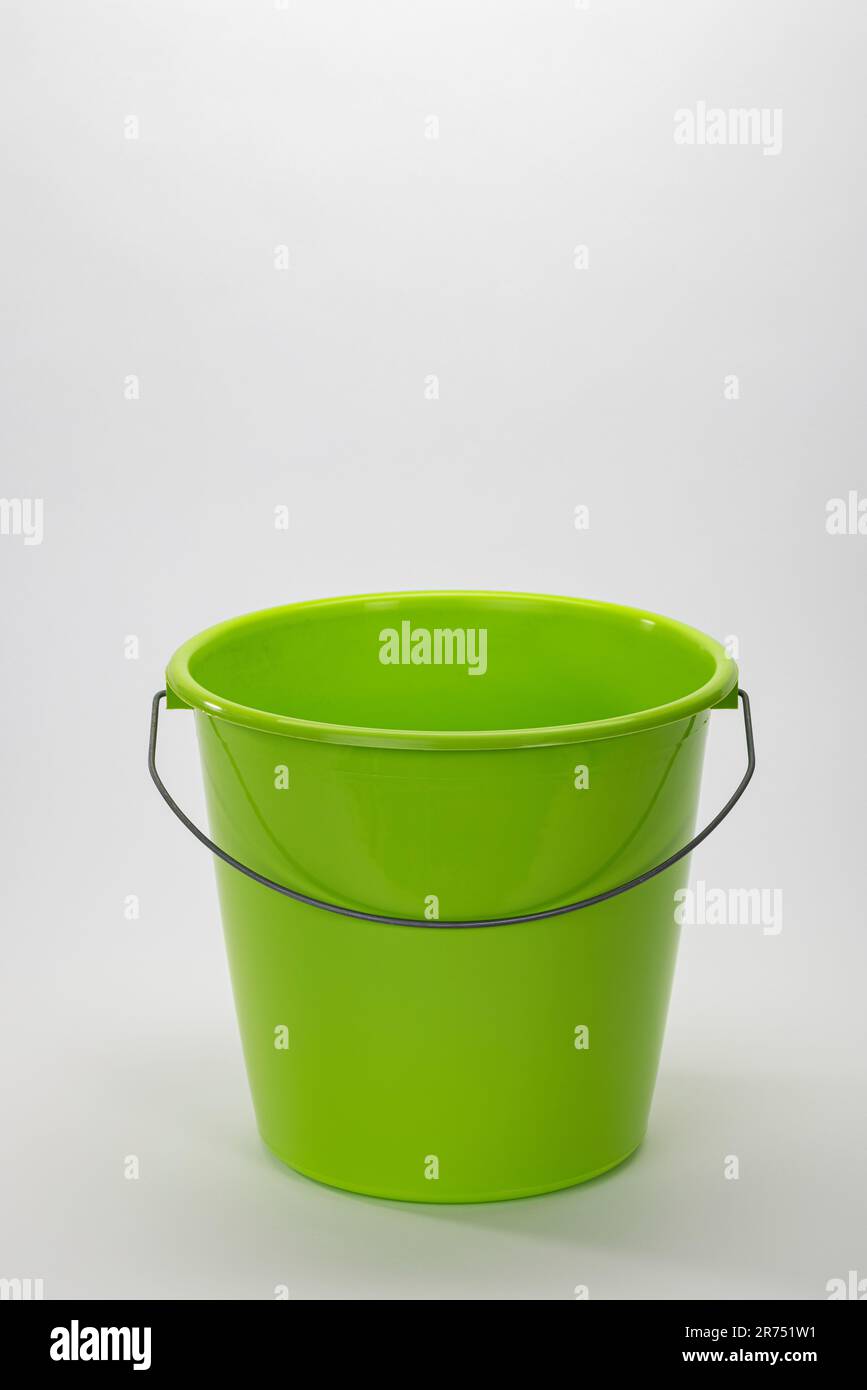 Green empty cleaning bucket, white background Stock Photo - Alamy