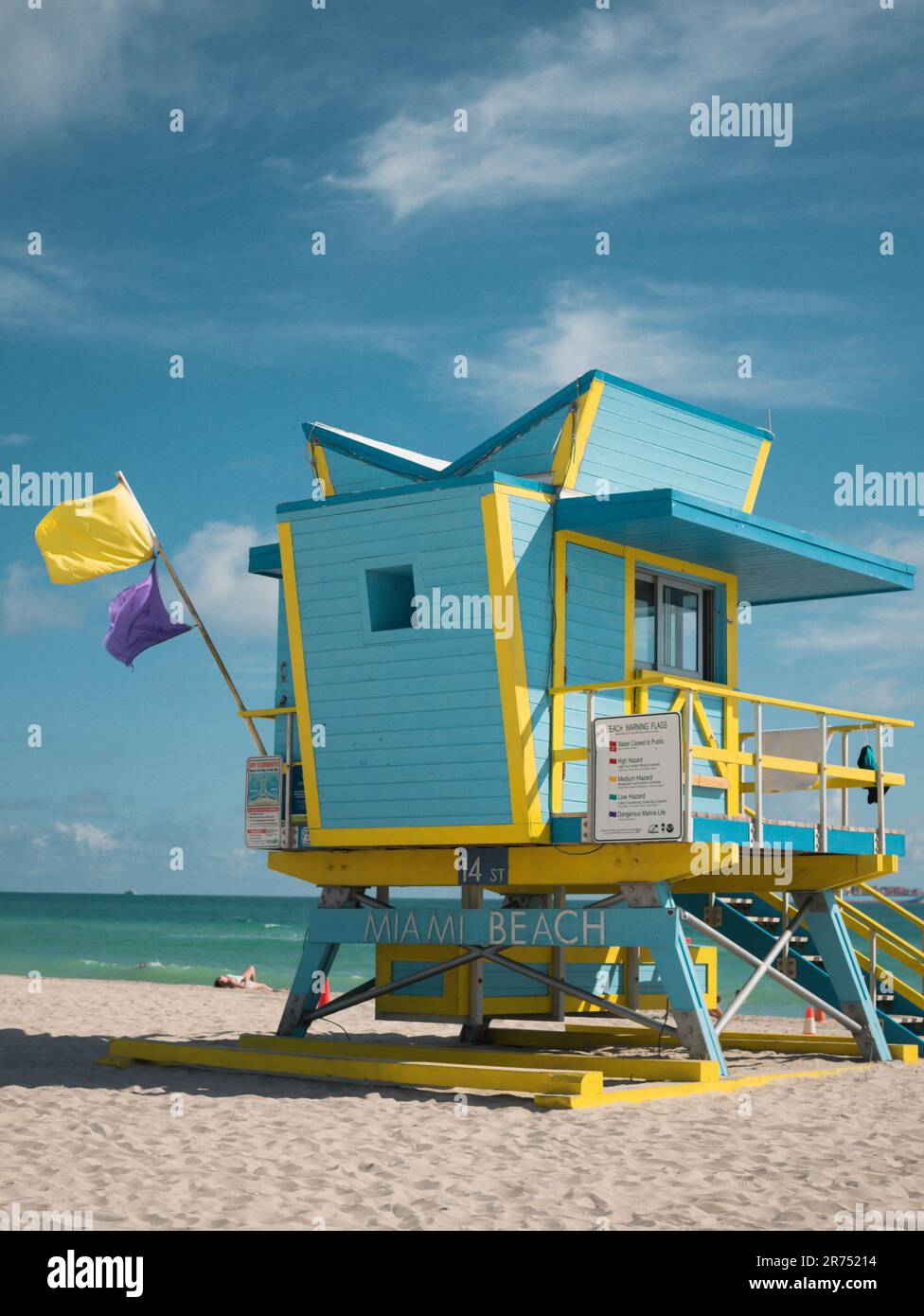 A vibrant and tranquil beach scene featuring a lifeguard tower with ...