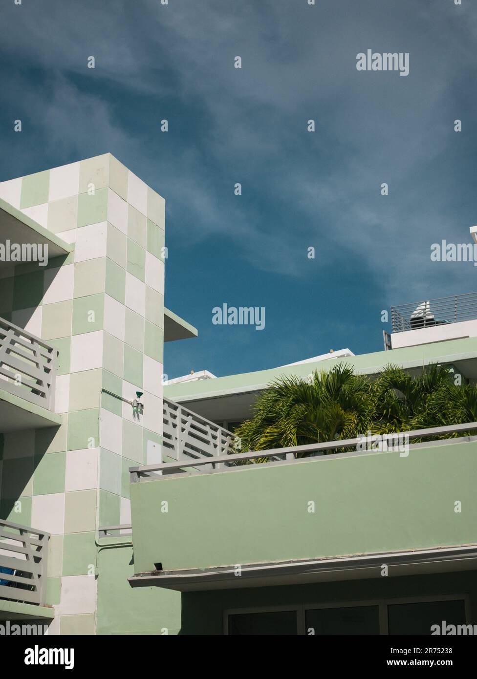 A modern building featuring white and green architectural accents set ...