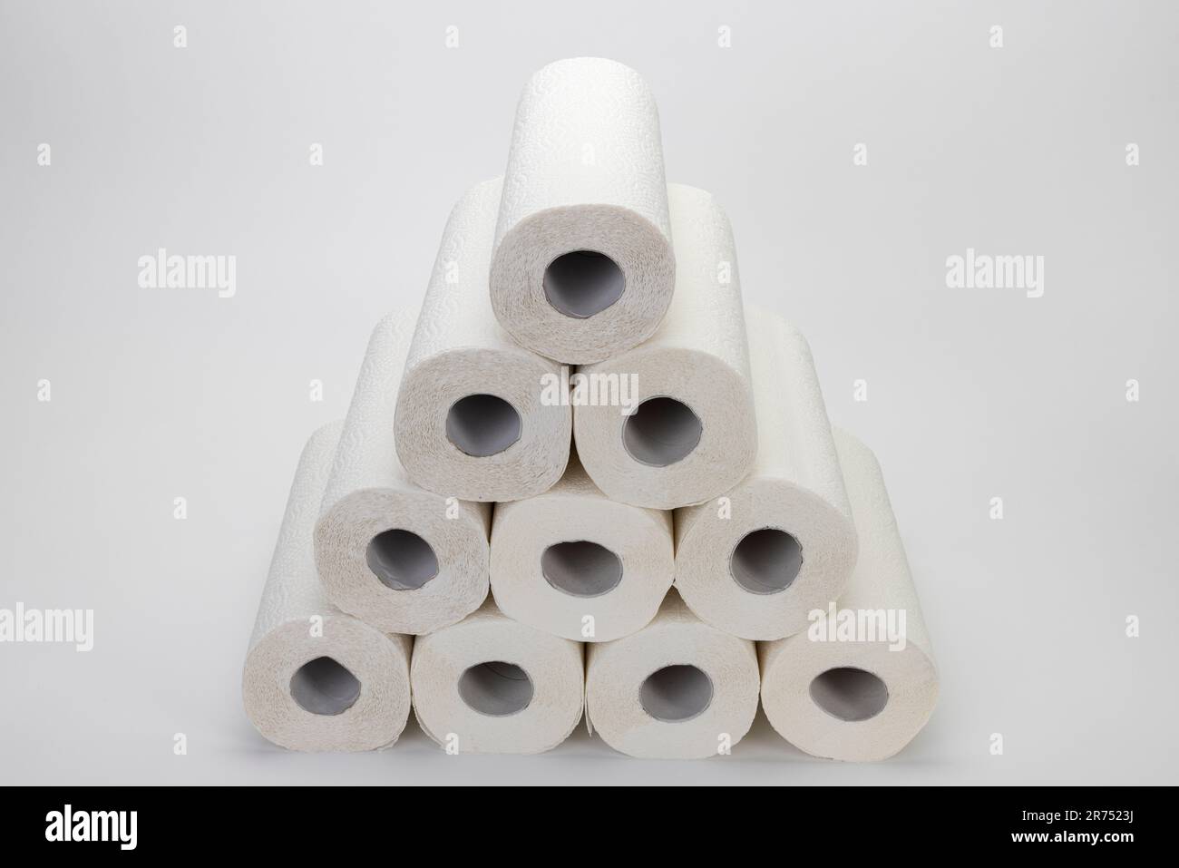 Stack of white kitchen rolls, white background Stock Photo - Alamy