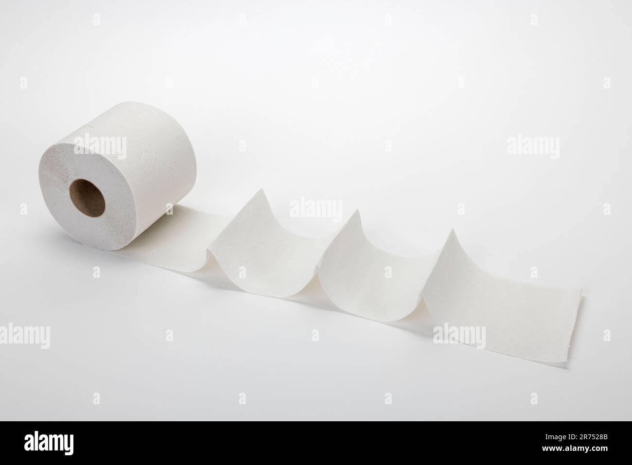Roll of toilet paper, white background Stock Photo - Alamy