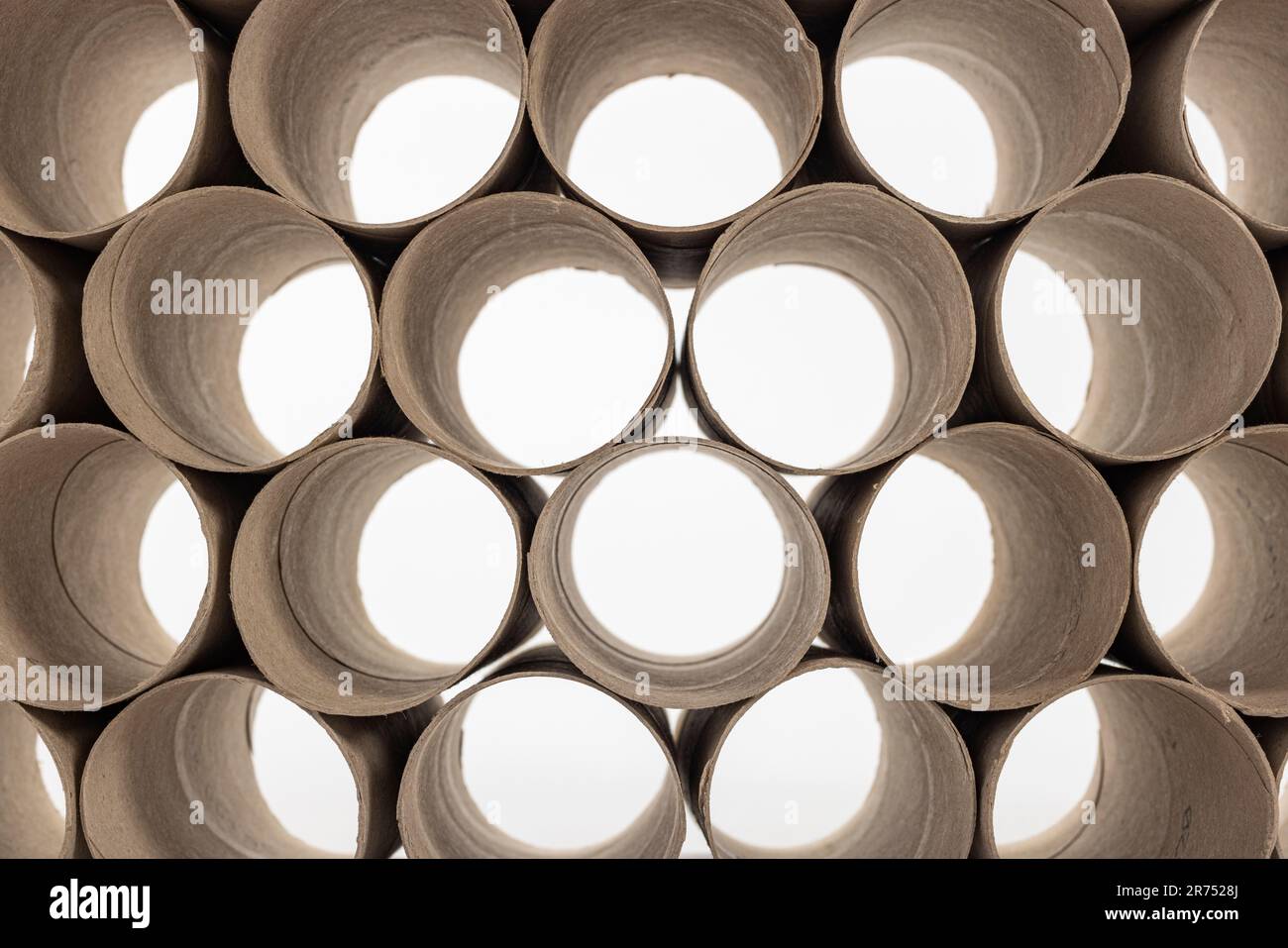 Many empty toilet paper rolls stacked, detail, white background Stock ...