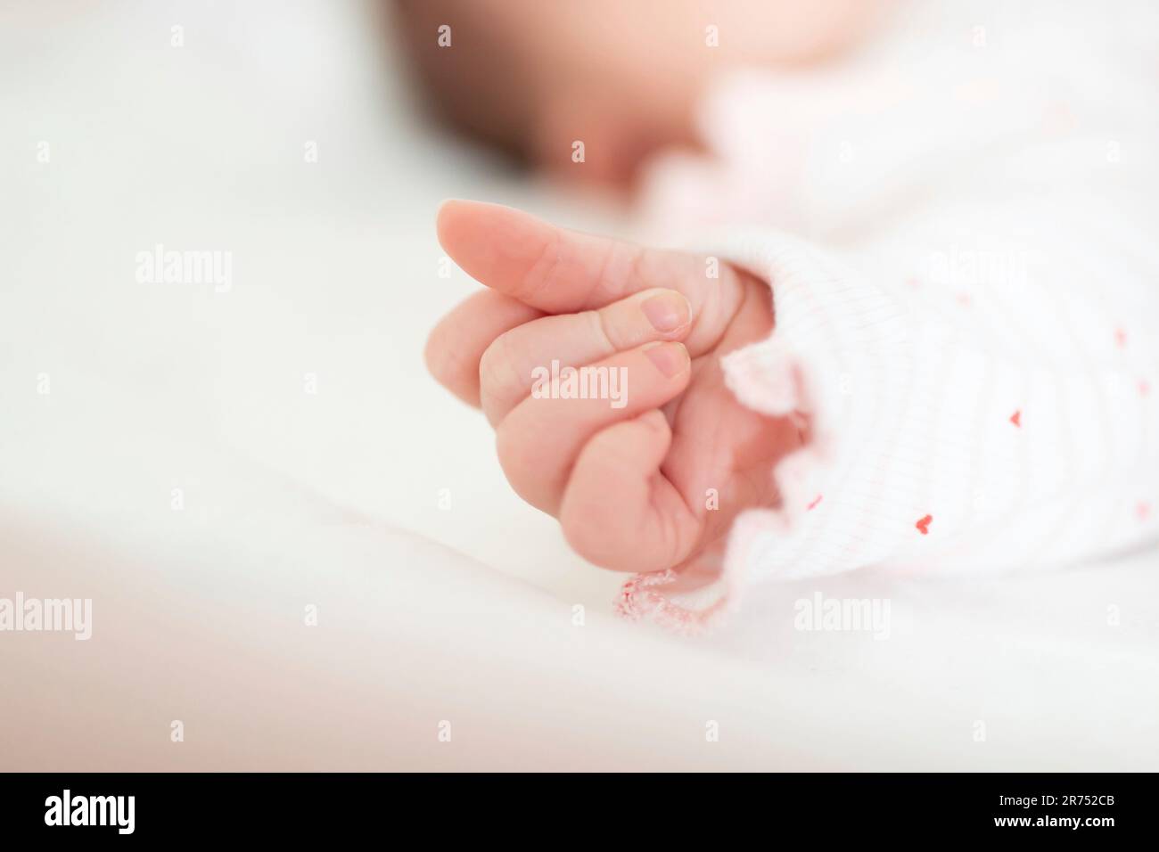 Baby hand hi-res stock photography and images - Alamy
