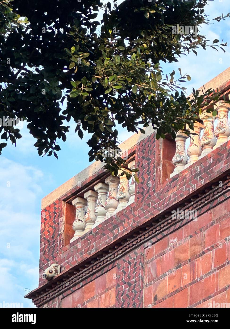 A low angle of an old red brick building with a balcony in China Stock ...