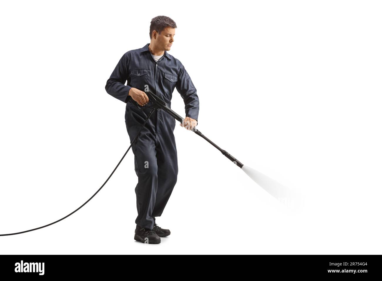 Full length shot of a man in a uniform using a pressure washer isolated ...
