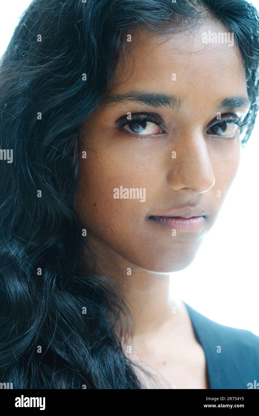Half frontal portrait of a woman looking into the camera Stock Photo ...