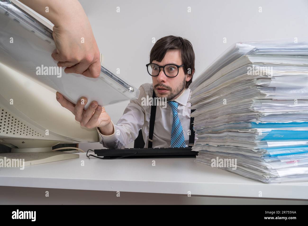 Tired and overworked man has many documents.on desk. Paperwork concept ...