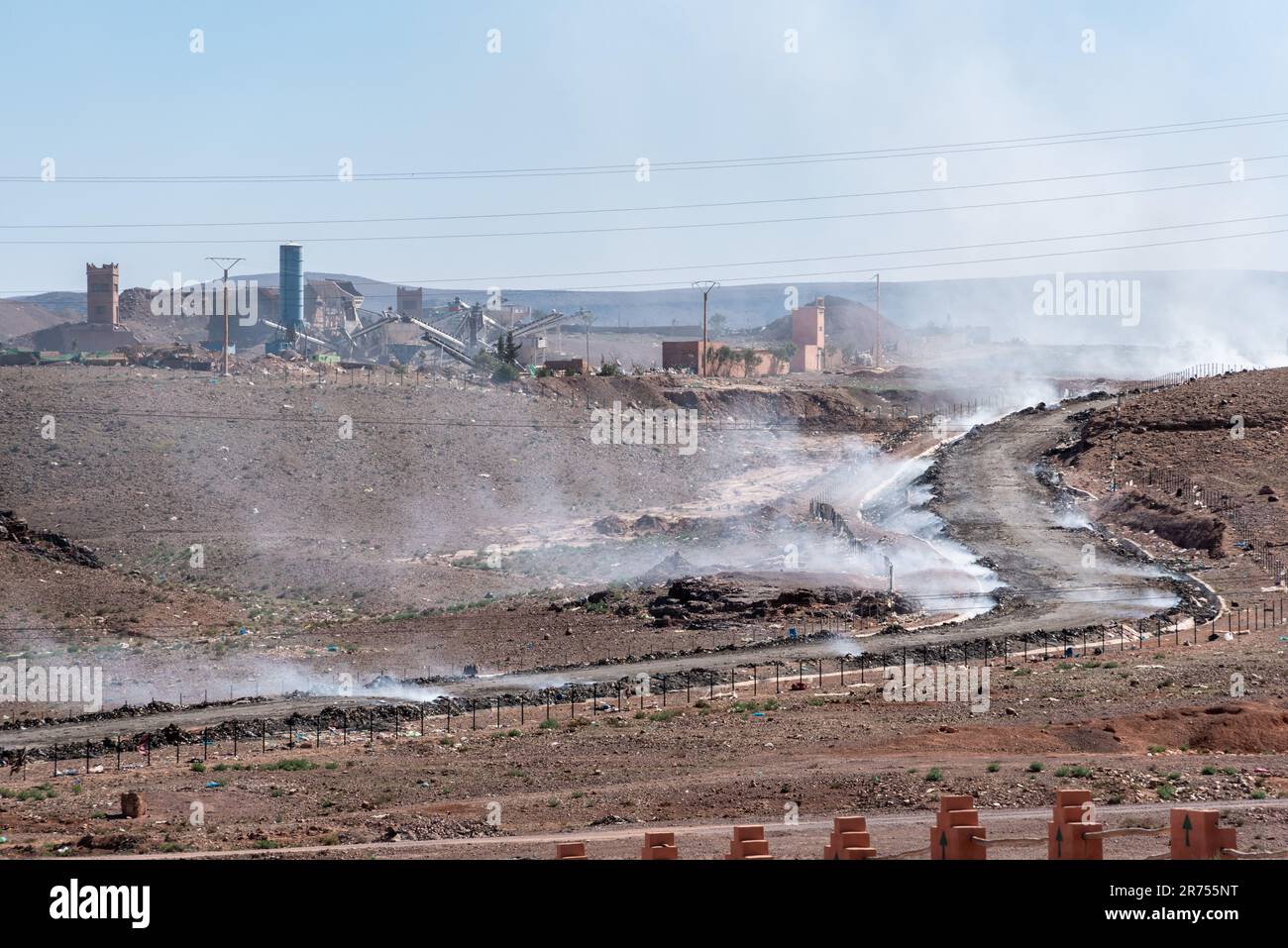 Trash being burned beside the road near the Draa valley in Morocco ...