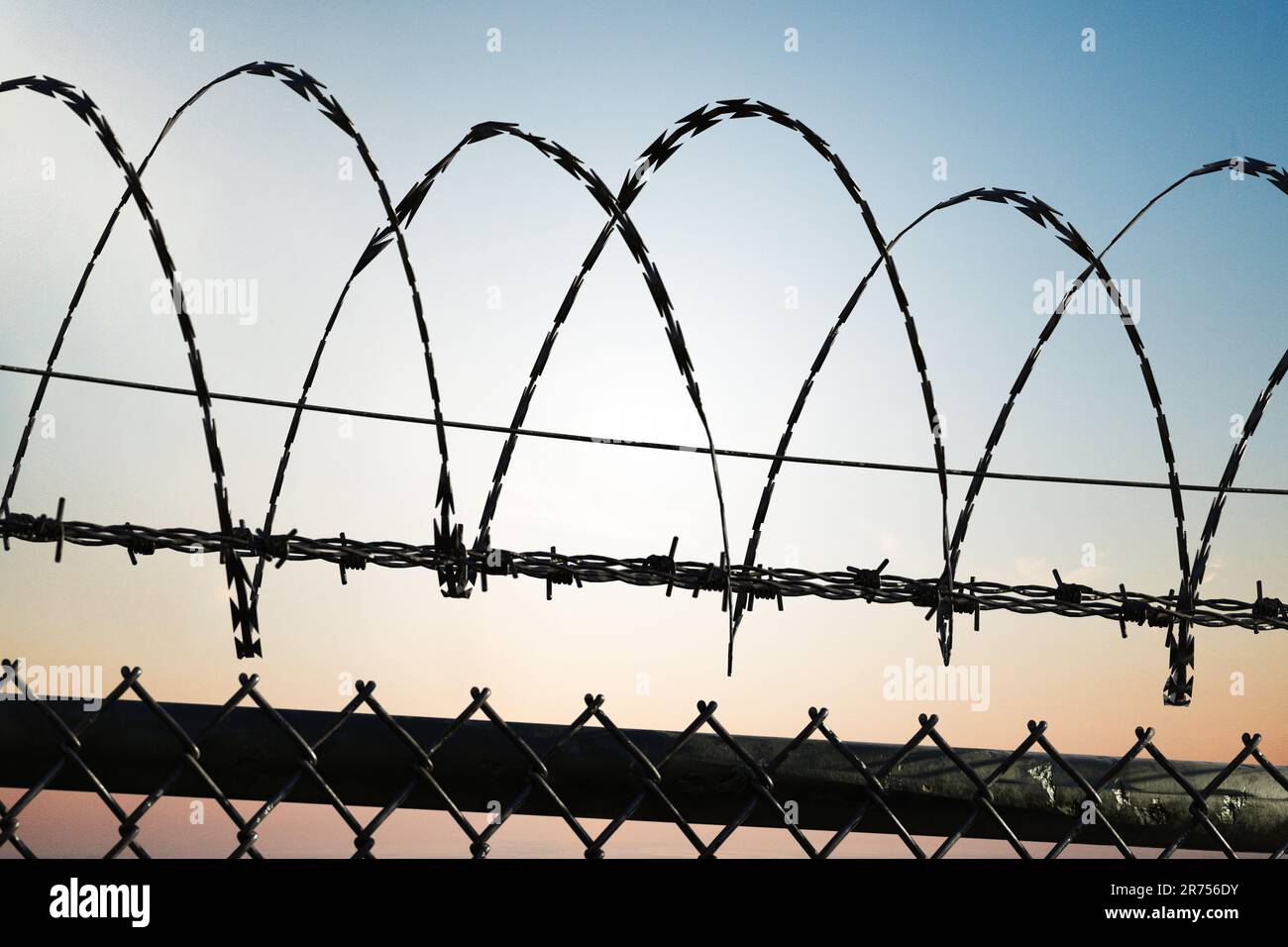 Barbed wire on prison fence, Security concept. 3D rendered illustration ...