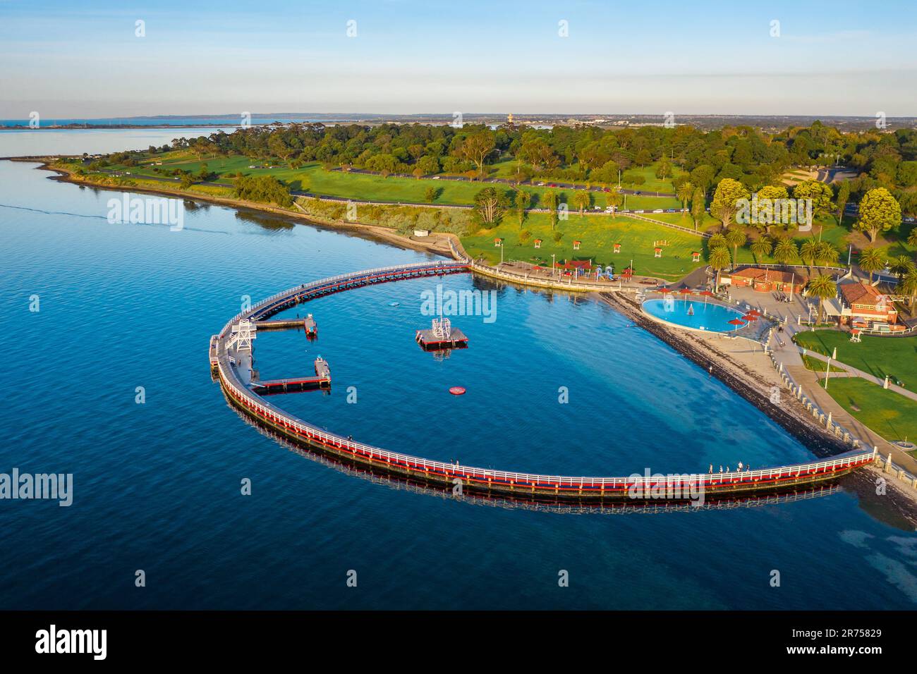 Aerial view of a circular swimming enclosure of parkland on the ...