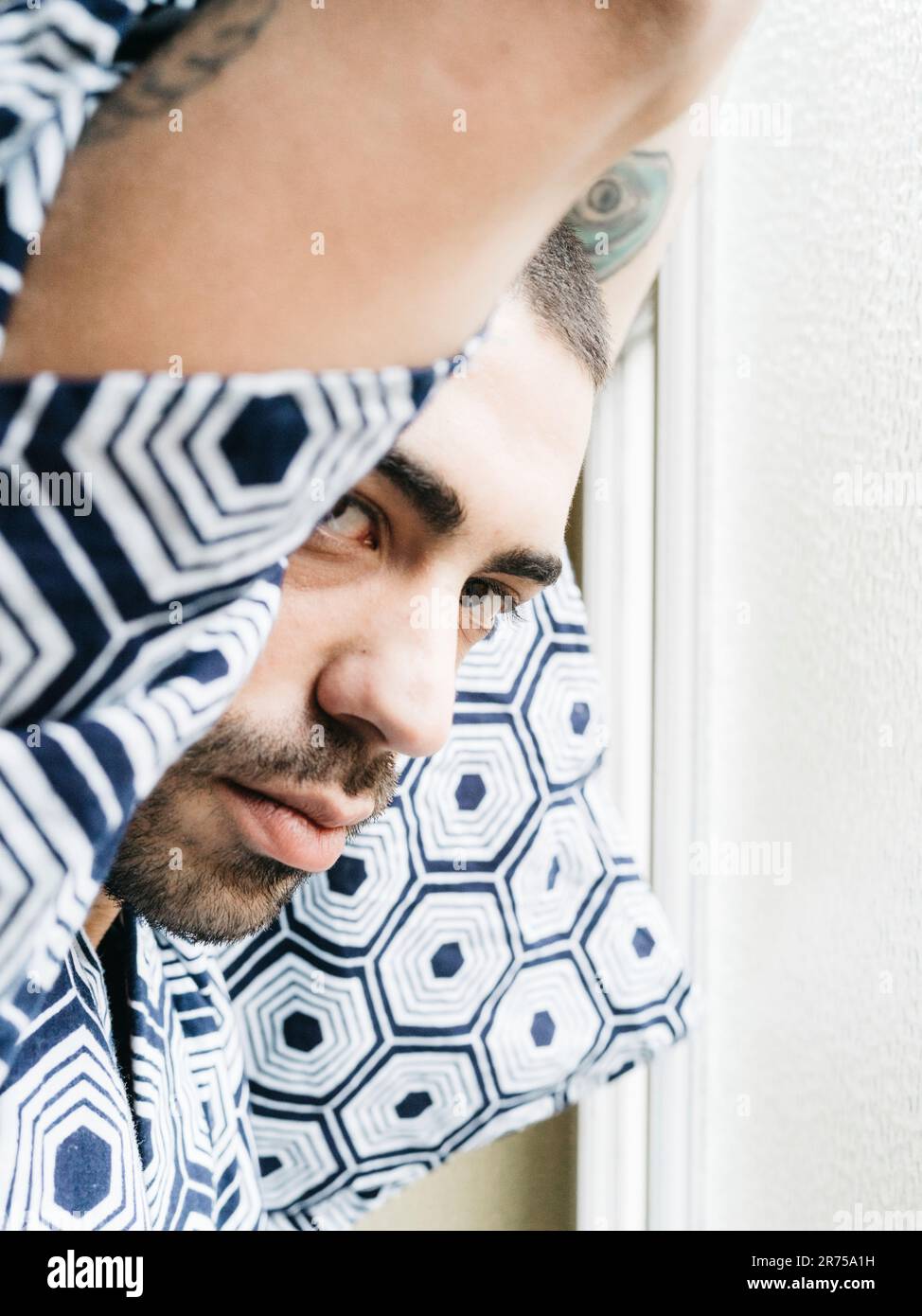 Man, short hair, housecoat, window, leaning, detail Stock Photo - Alamy