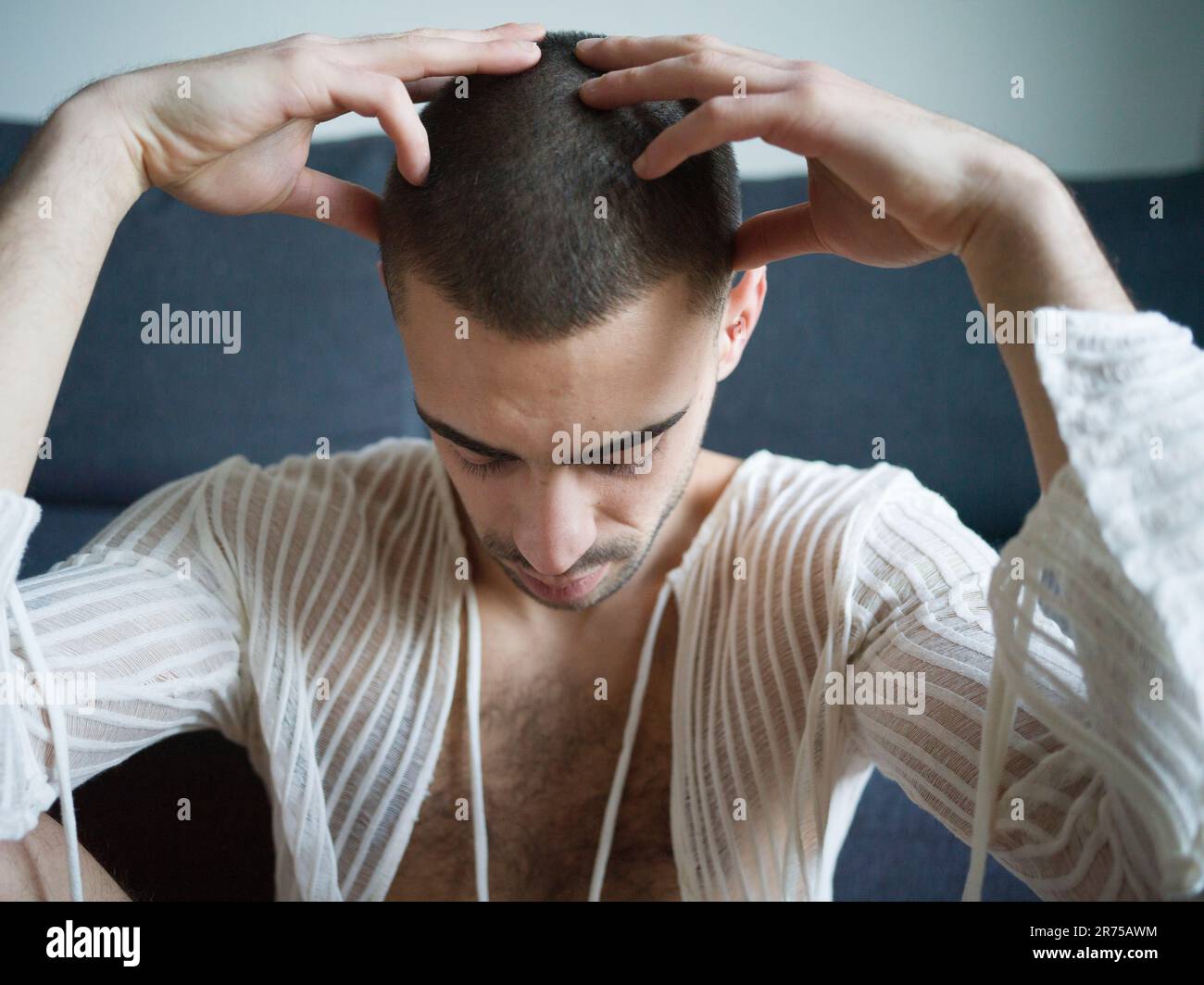 man, short hair, gesture, hands, head, portrait, gaze lowered Stock ...