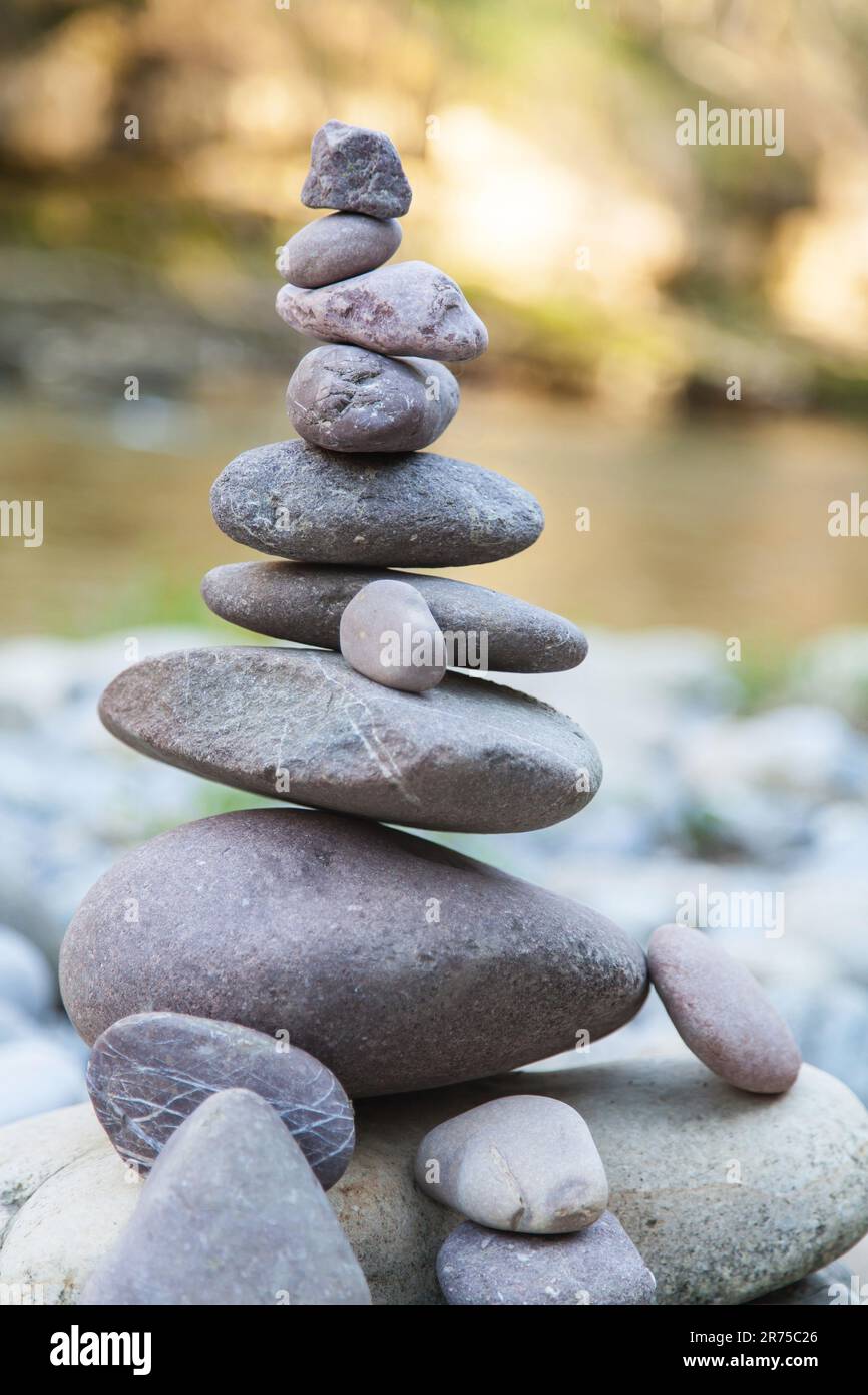 stone tower on river shore Stock Photo - Alamy