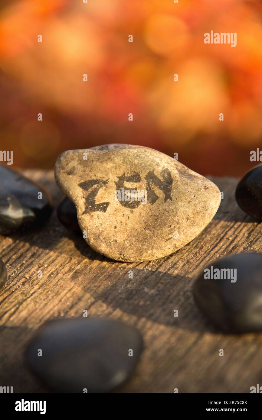 massage stones and a stone lettering ZEN Stock Photo - Alamy