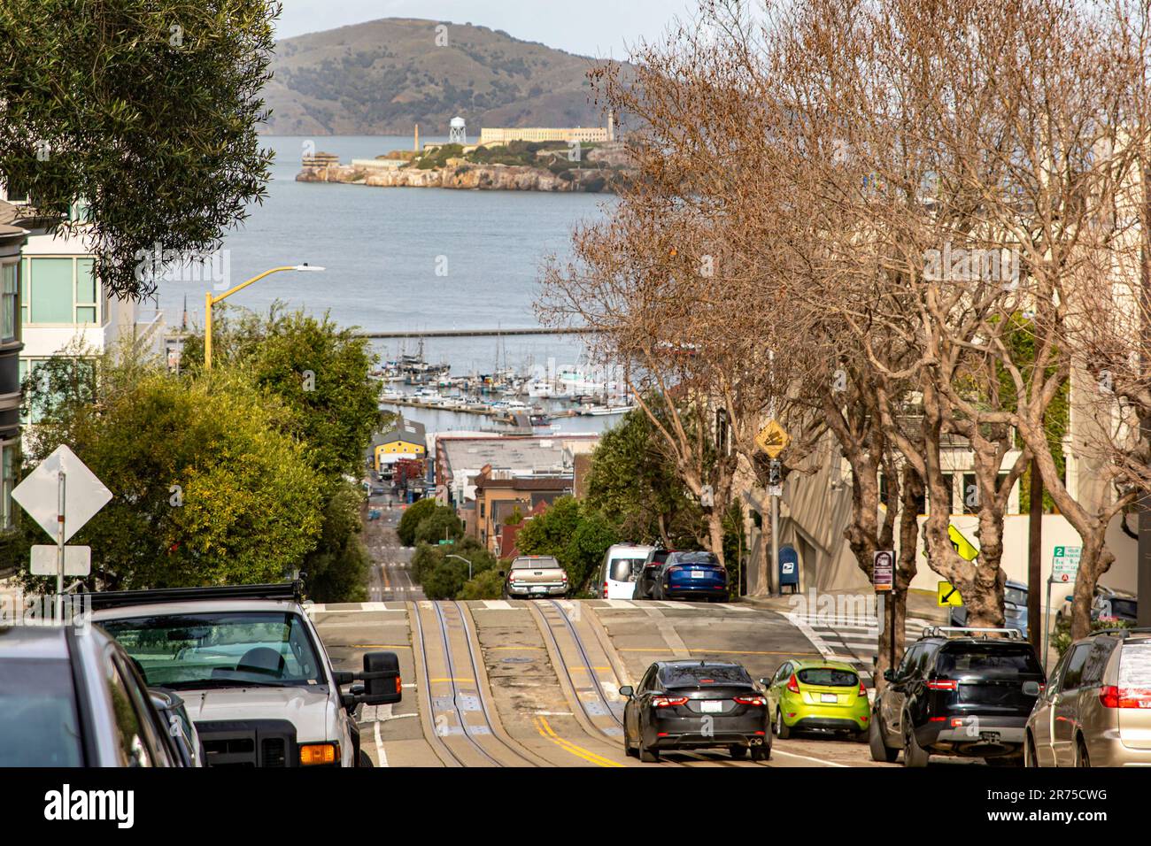 The famous Lombard Street in San Francisco with tram and Alcatraz ...