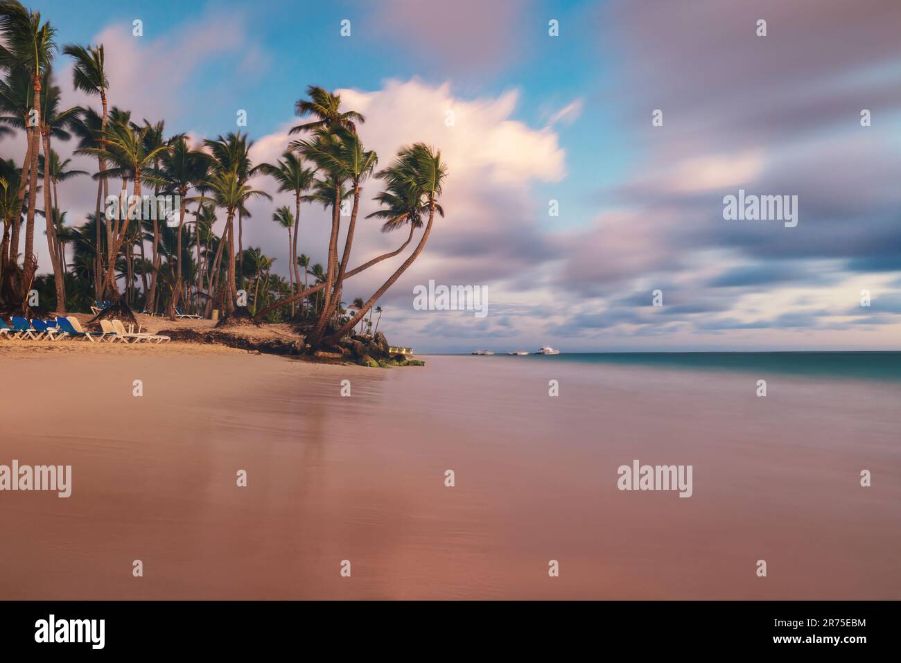 Sunrise with scenic cloudscape of paradise exotic island beach and ...