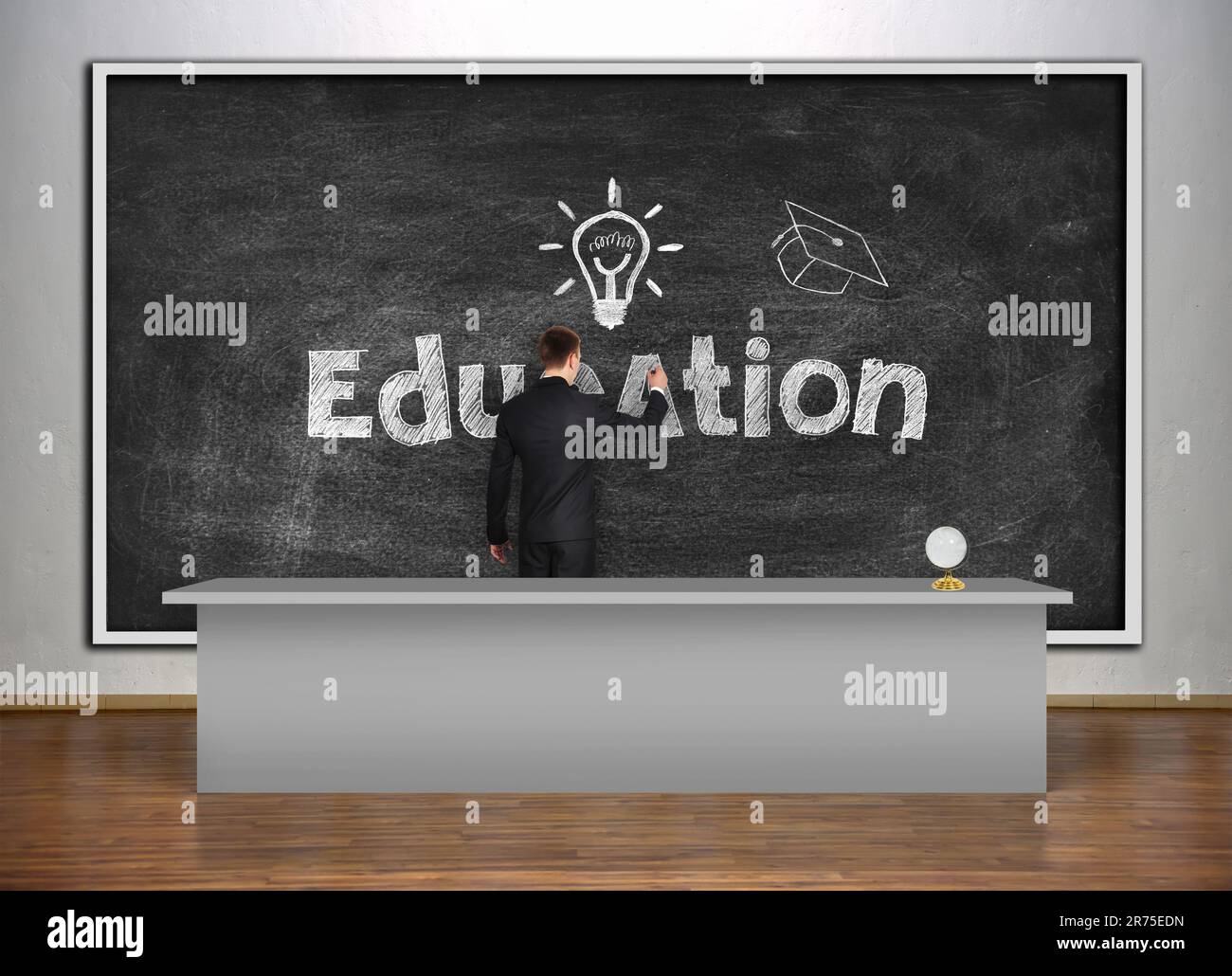 teacher drawing education concept on black board in classroom Stock ...