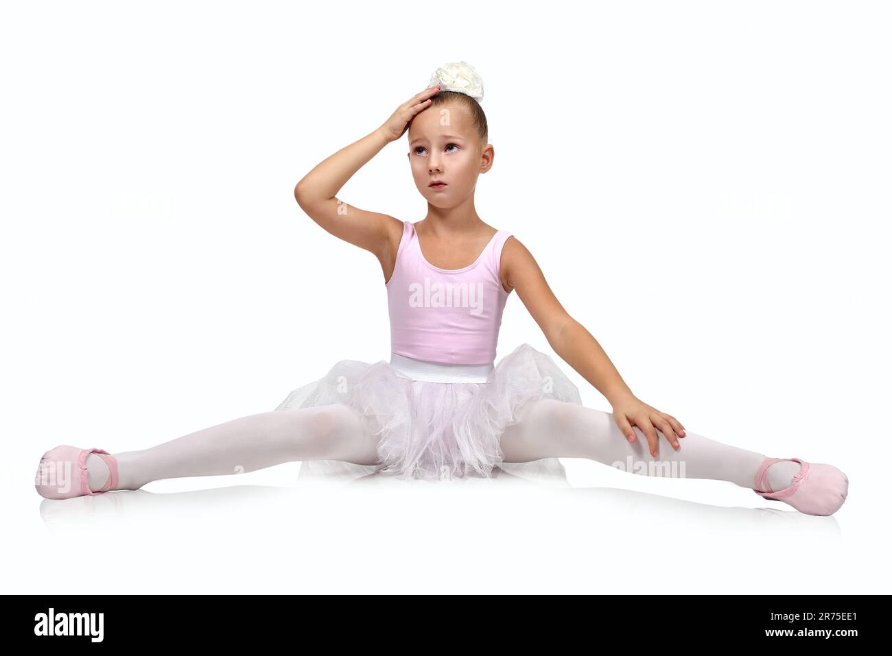 little ballerina sitting in tutu on floor Stock Photo - Alamy