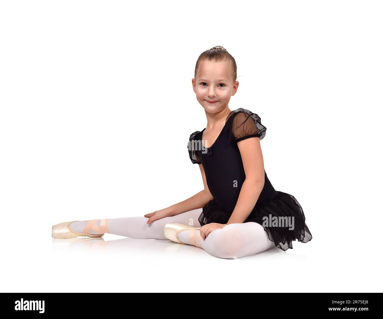 Young ballet dancer in black tutu sitting on floor Stock Photo - Alamy