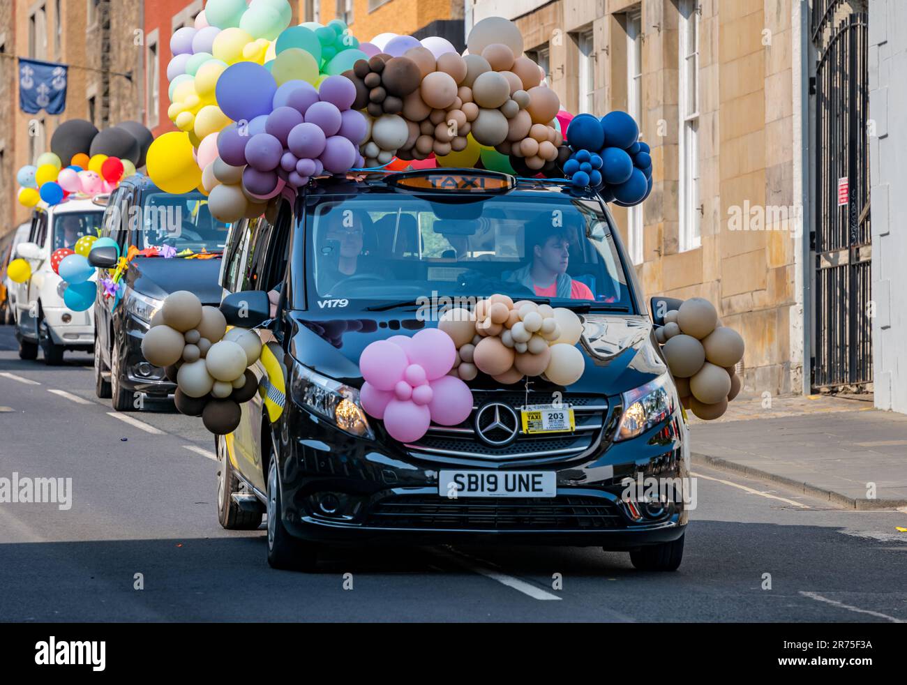 Royal Mile, Scotland, UK, 13 June2023, Edinburgh Taxi Outing: taxi drivers take children with ...