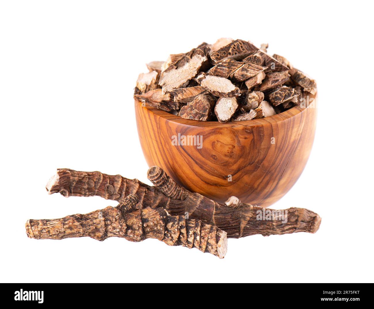Calamus root in wooden bowl, isolated on white background. Sweet flag ...
