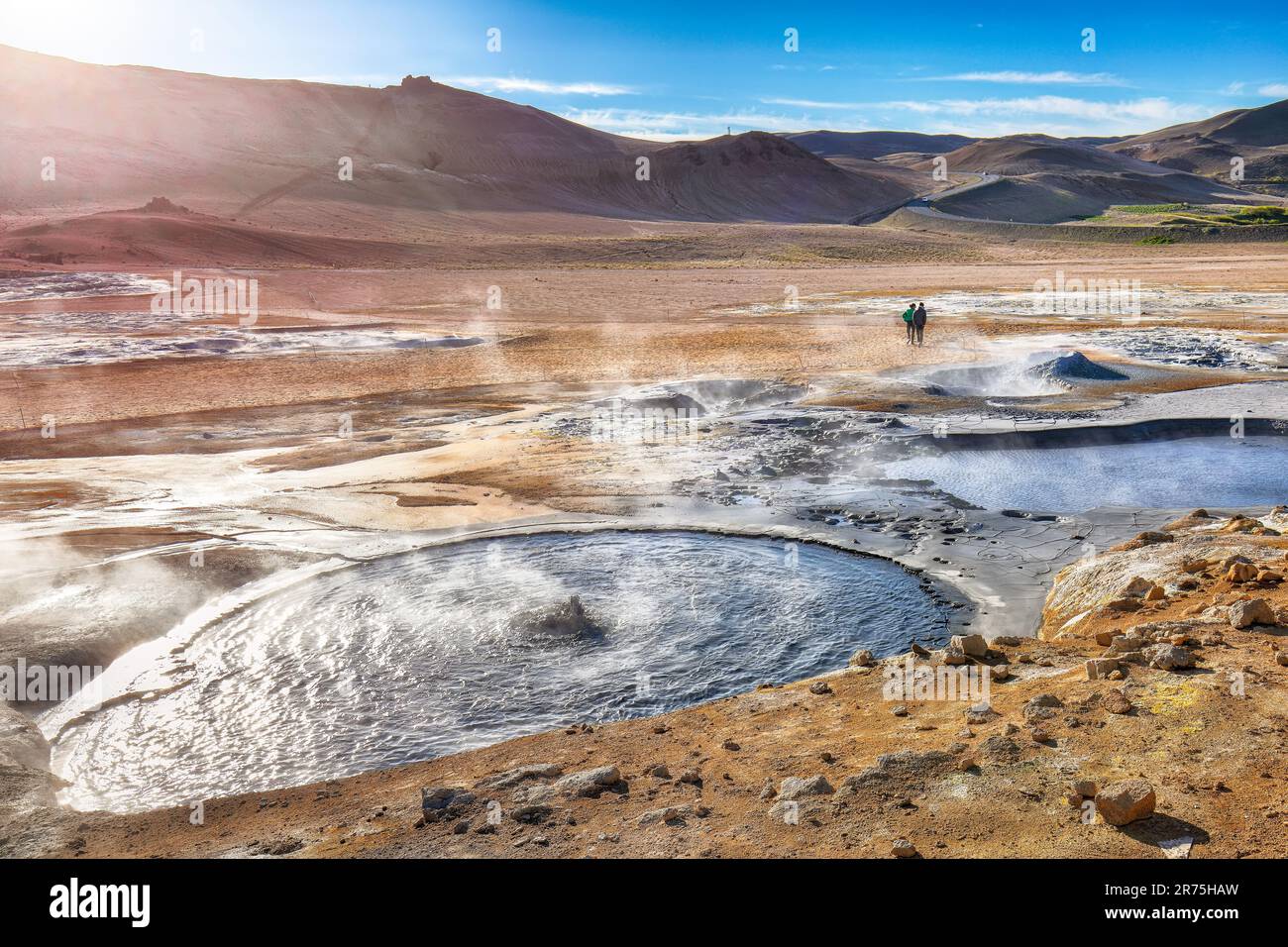 Breathtaking boiling mudpots in geothermal area Hverir and cracked ...
