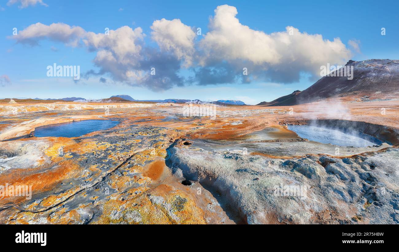 Breathtaking boiling mudpots in geothermal area Hverir and cracked ...