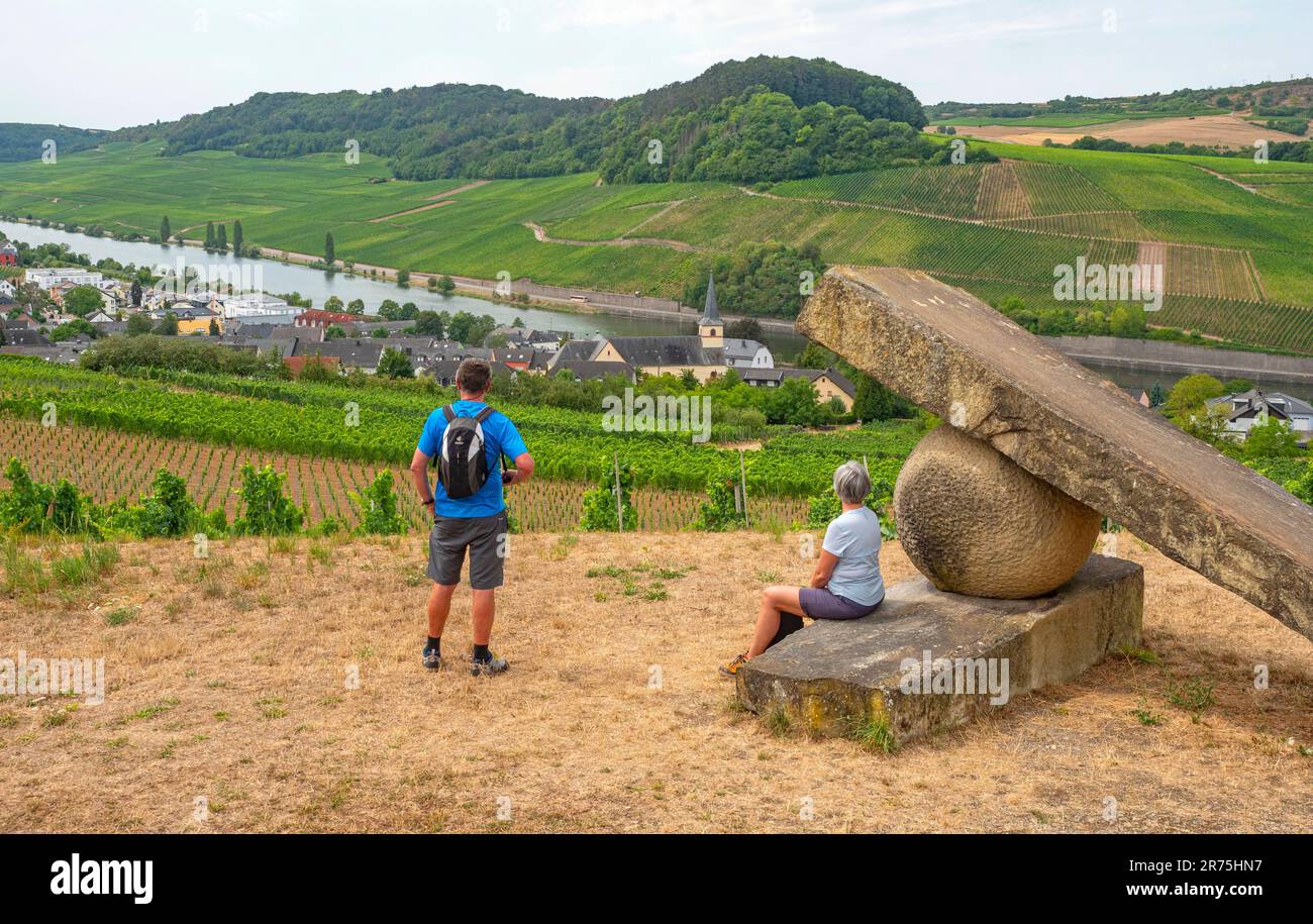 Hiker at the sculpture knee with joint near Nittel, Moselsteig stage 2 Palzem-Nittel, Upper ...
