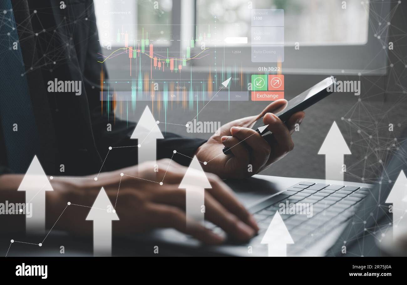 Man monitoring stock market trends and trading activities Stock Photo ...