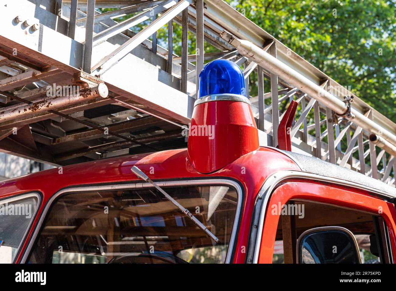 Blue flashing light and part of the arrow on a vintage fire track ...