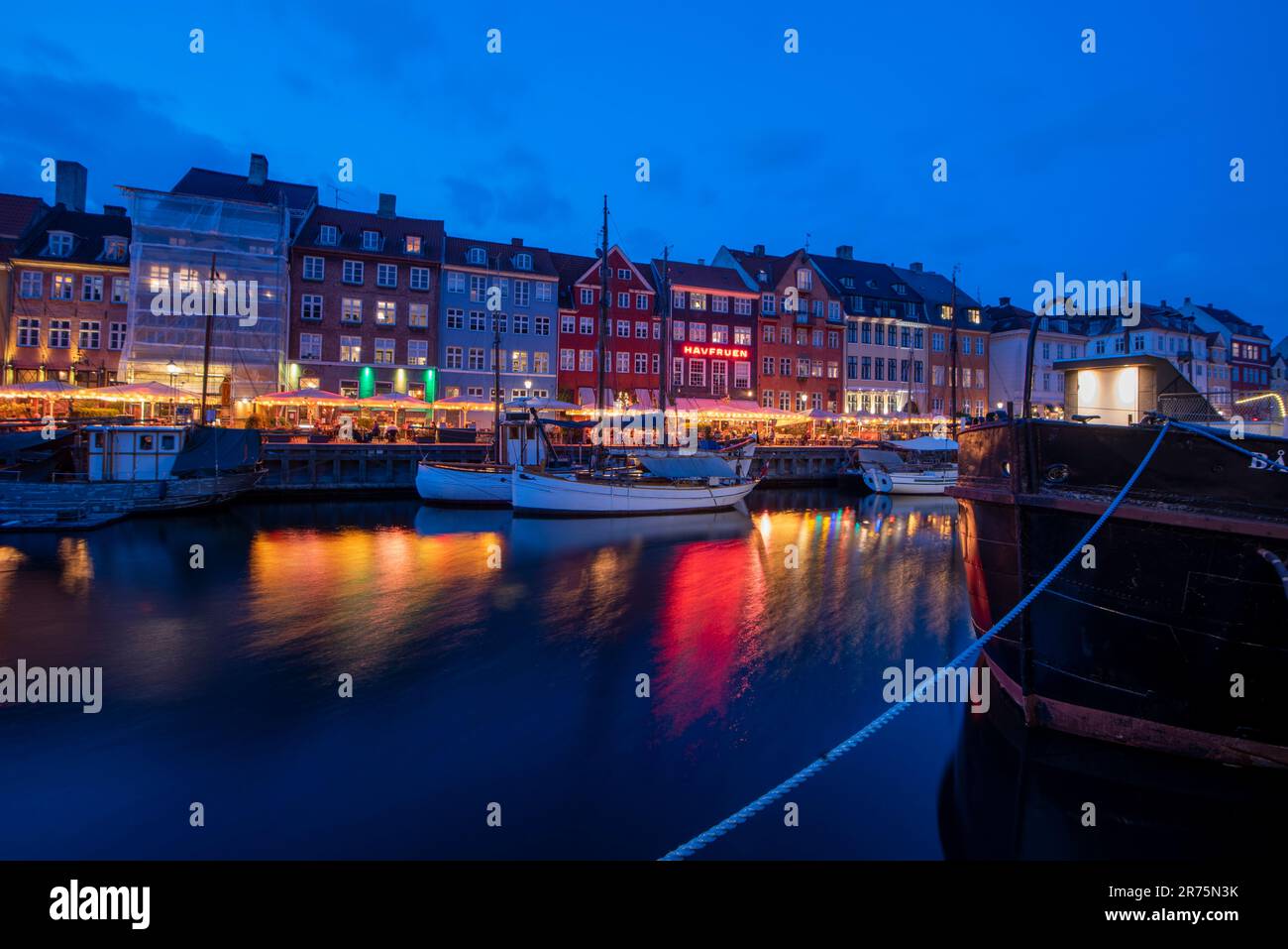 Nyhavn with colorful houses at blue hour, is considered the most ...