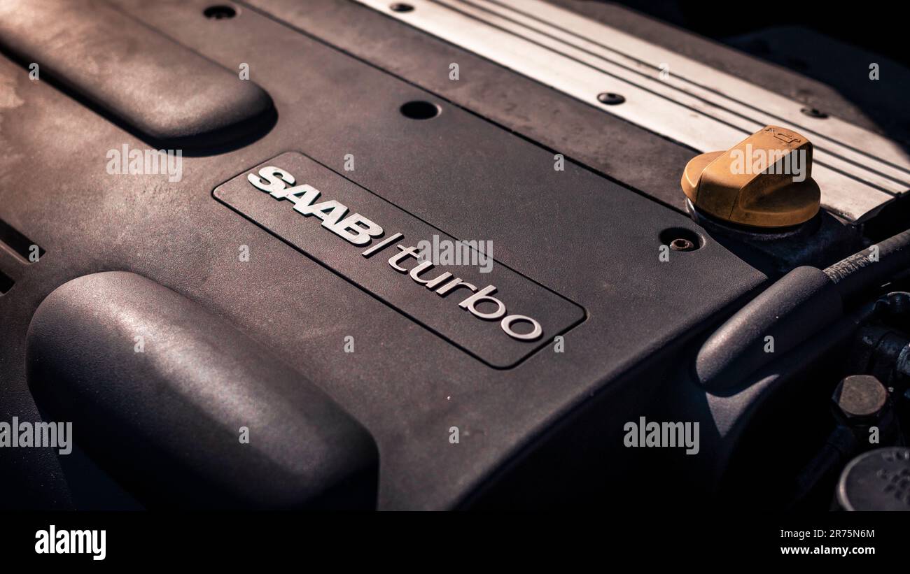 A close-up of the engine of a Saab car, showcasing the iconic logo of ...