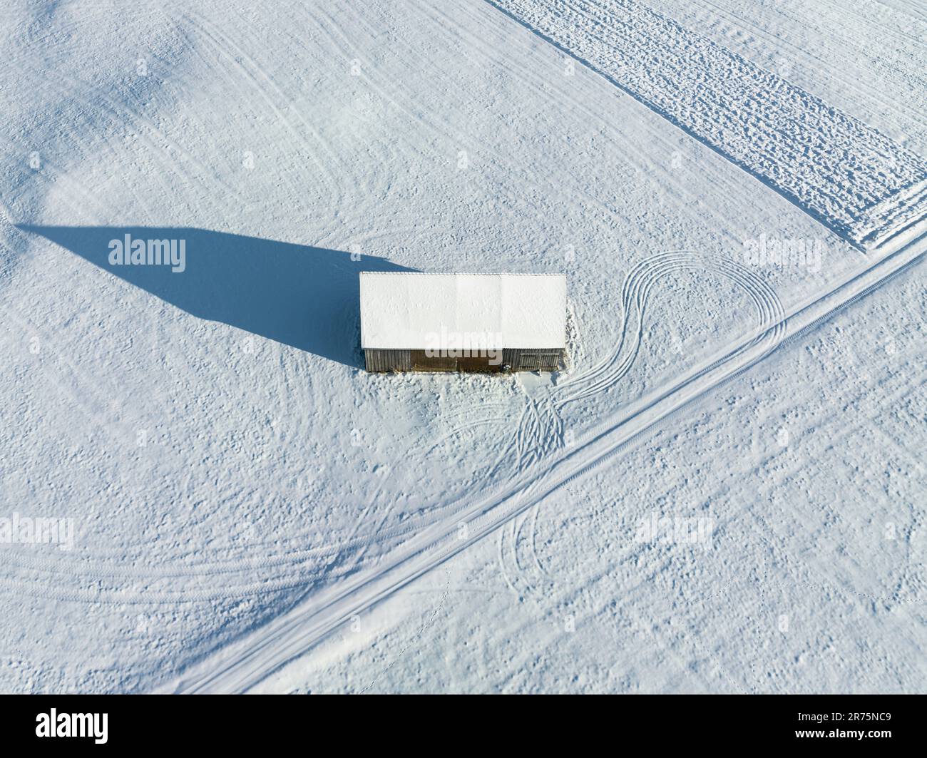 Bird's eye view of barn in winter with snow covered meadow Stock Photo ...